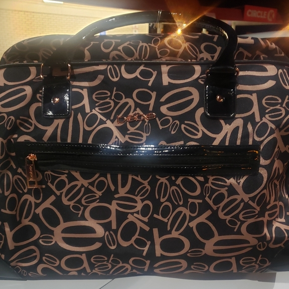 bebe | Bags | Bebe Rolling Duffel Bag | Poshmark